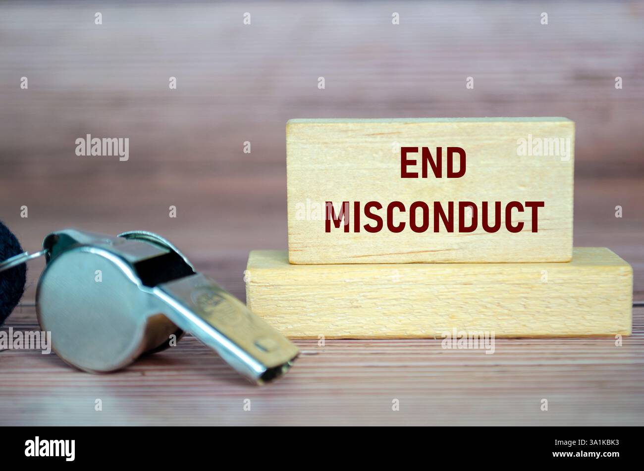 End Misconduct text on wooden blocks with whistle background ...