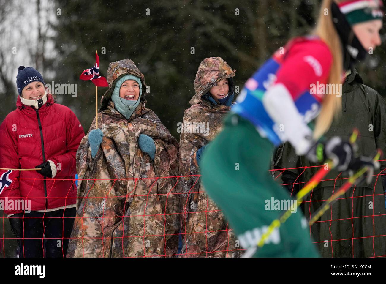 Fans brave the weather to cheer on the athletes in the cross-country ...