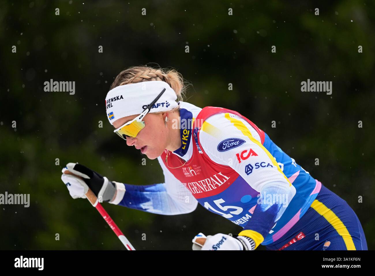 Frida Karlsson, of Sweden, competes in the cross-country women's mass ...