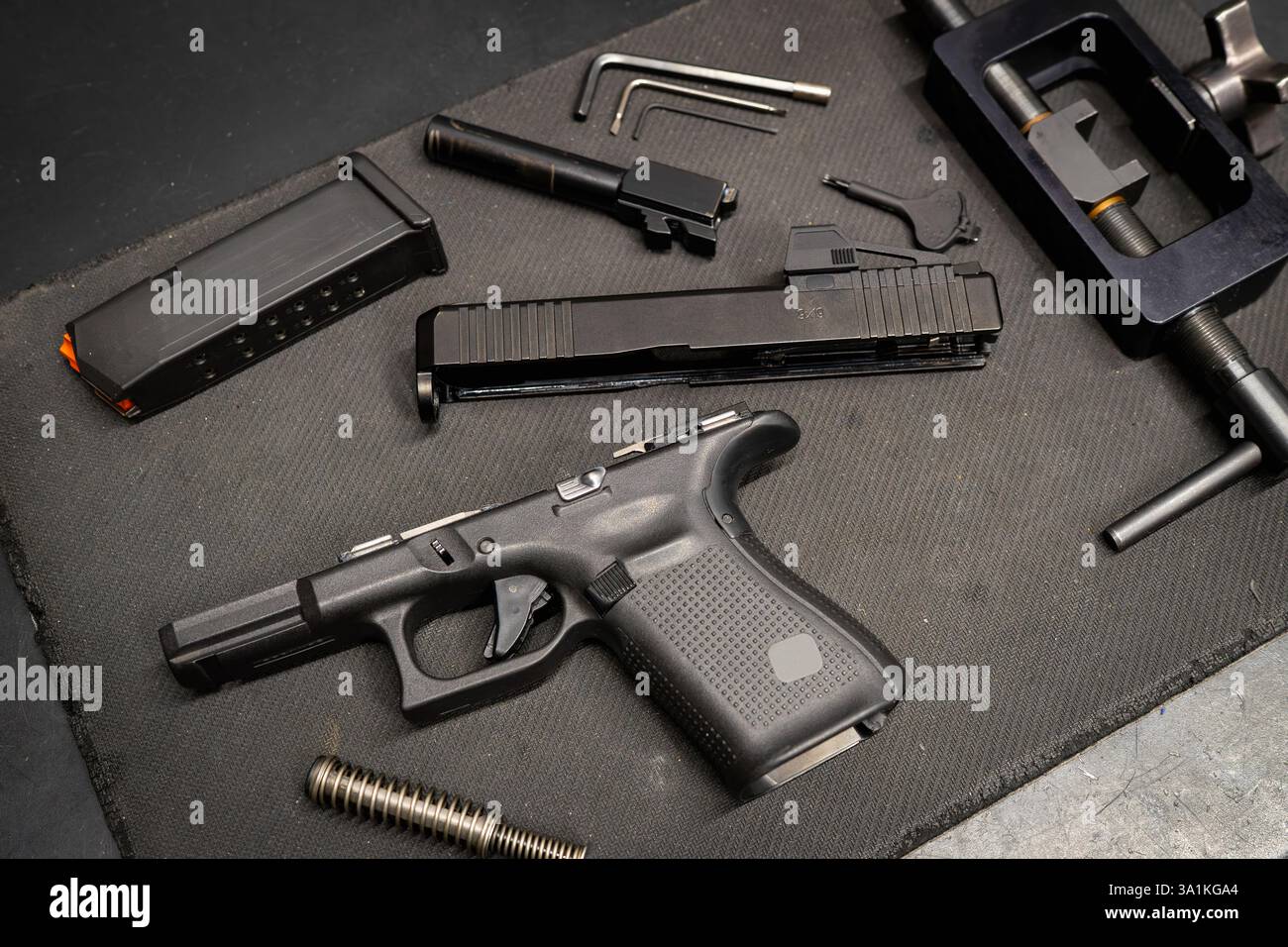 Maintenance and repair of modern firearms, disassembled pistol with ...