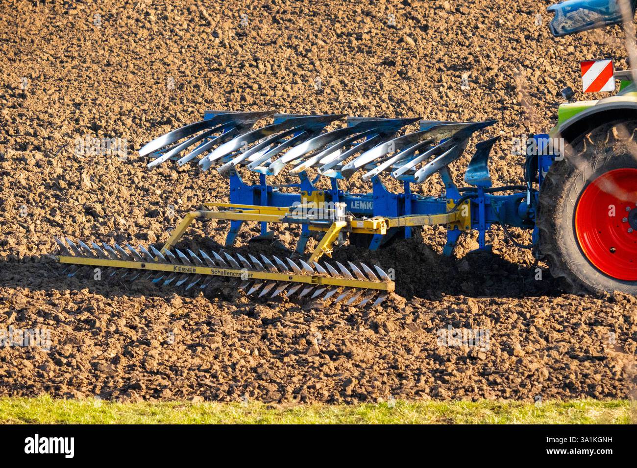 District of Augsburg, Bavaria, Germany - 8 March 2025: A tractor with a ...