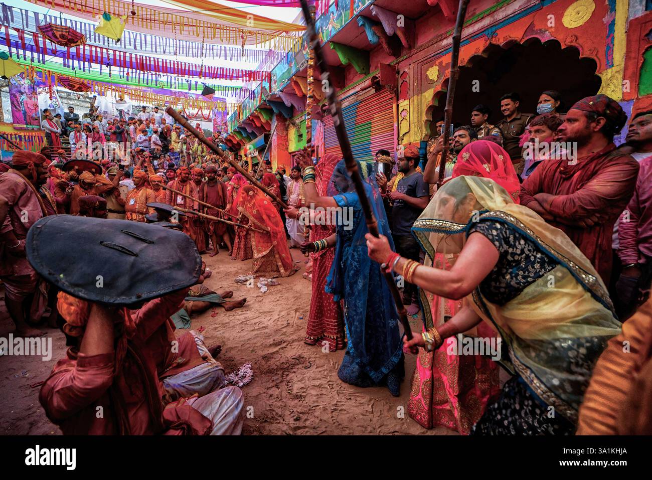 A group of women seen holding sticks (Lathi) ritually for beating Hindu ...