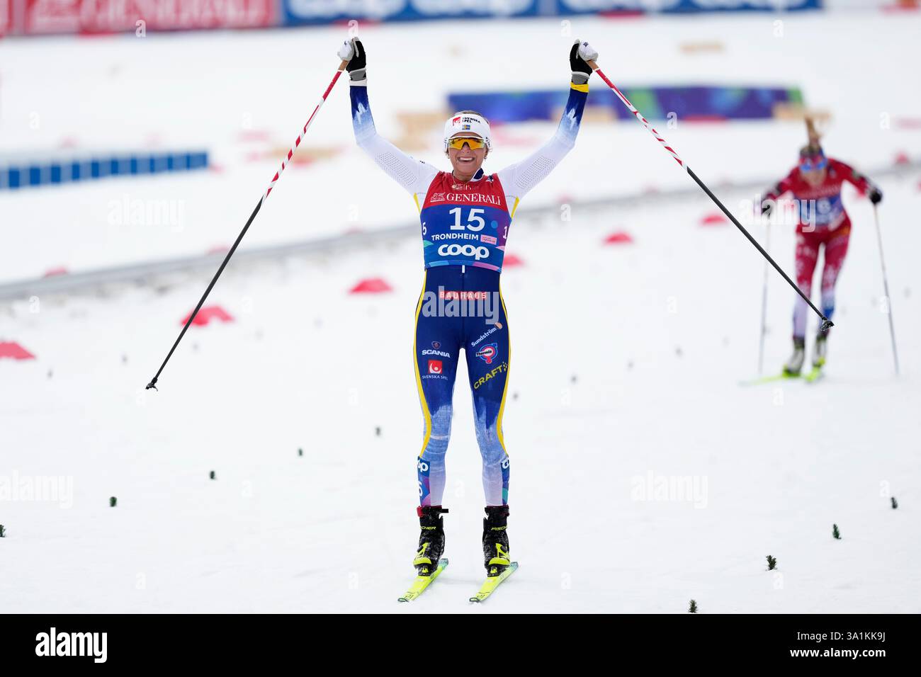 Frida Karlsson, of Sweden, crosses the finish line to win the gold ...