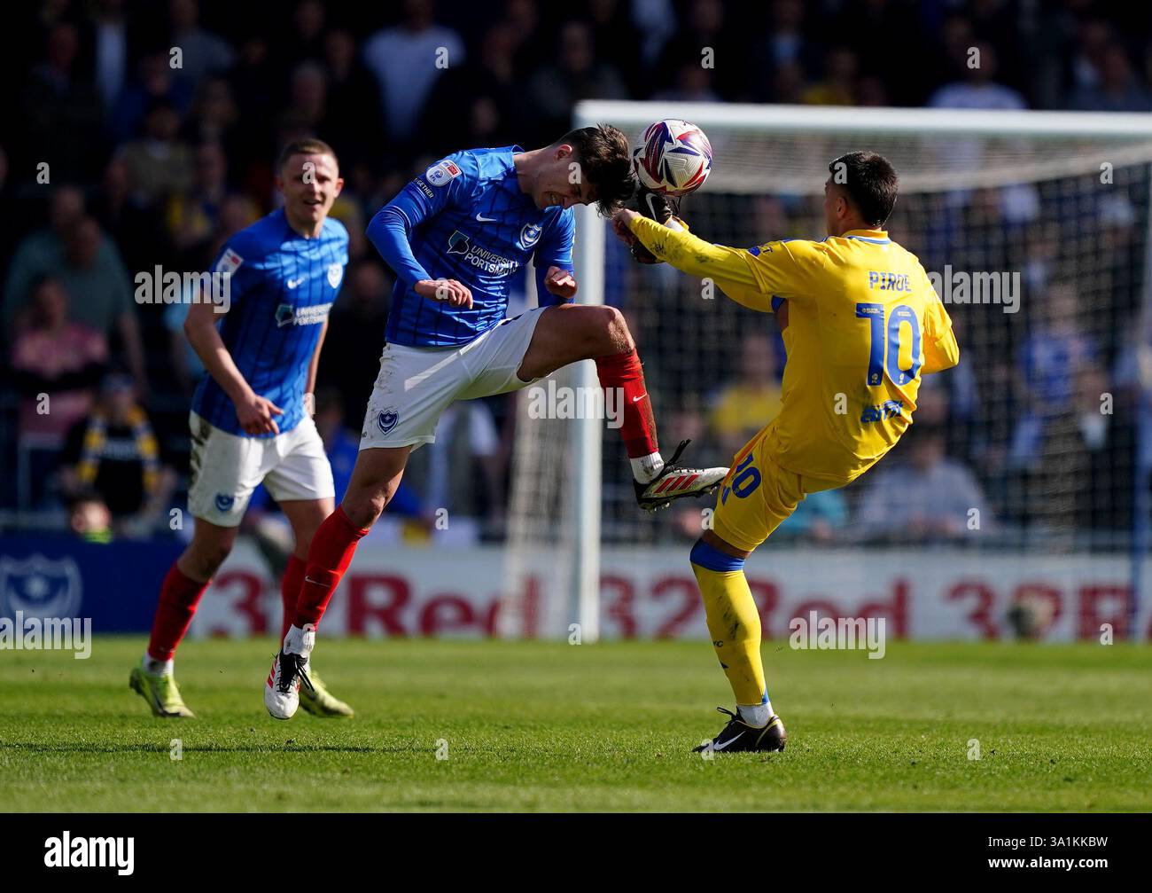 Leeds United's Joel Piroe (right) and Portsmouth's Freddie Potts (left ...