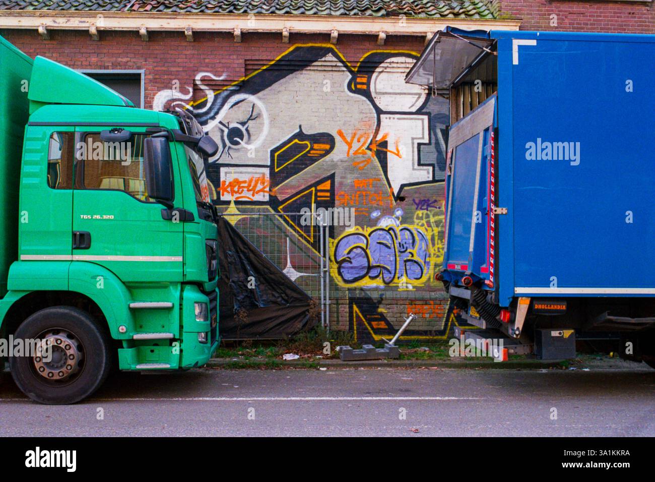 Tracks & Graffiti. Parked Trucks, Vehicles and an Old, Habour Warehouse ...