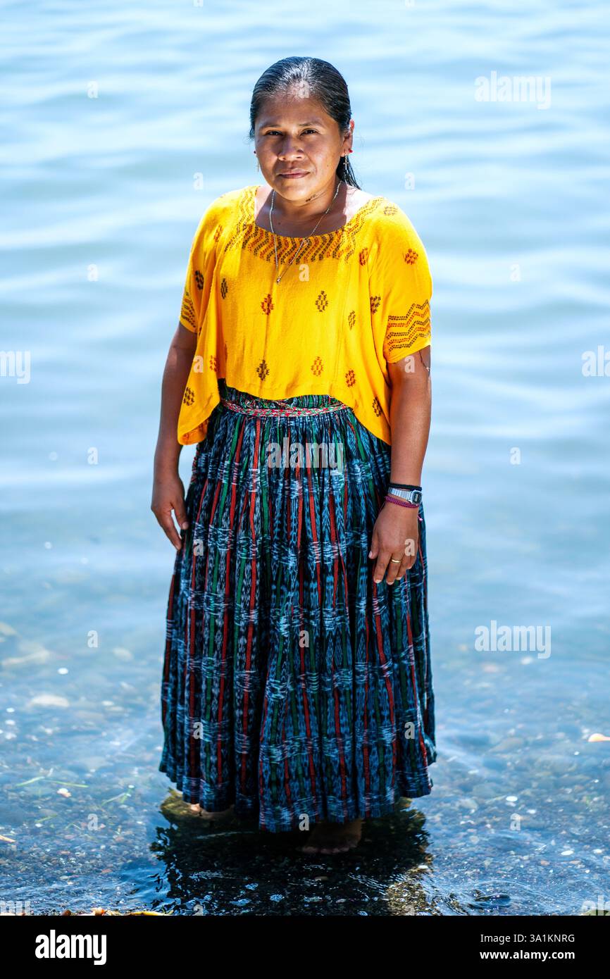 Sylvia Patricia Caal, 35, from Rubal Pec, stands in the waters of Lake ...