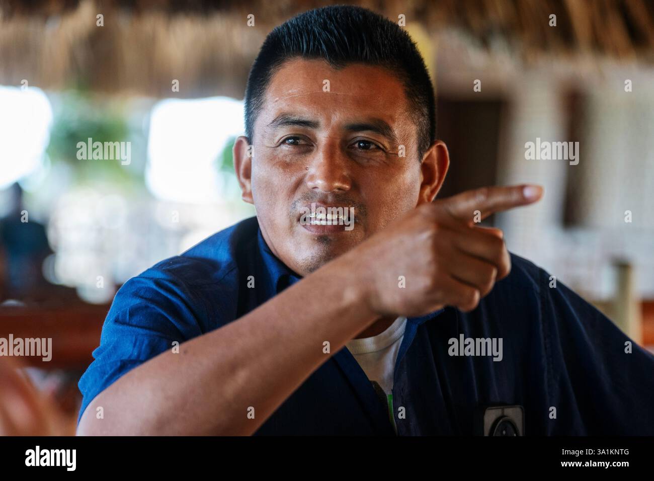 Gabriel Xi Pochan speaking to journalists in El Estor, Guatemala. The ...