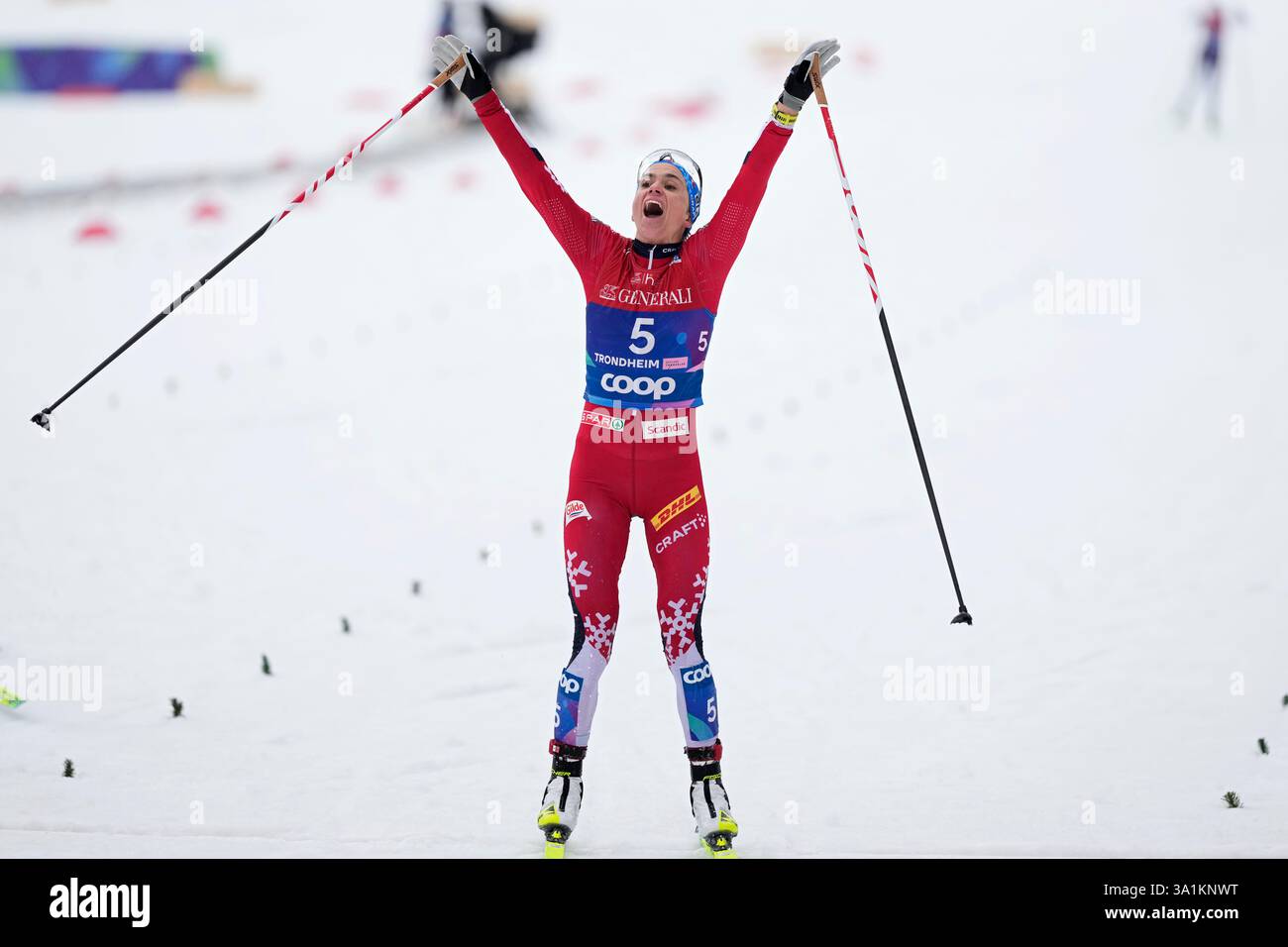 Heidi Weng, of Norway, crosses the finish line to win the silver medal ...