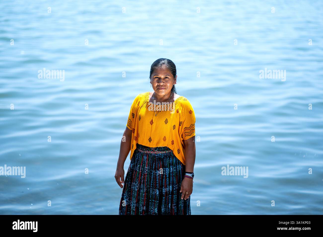Sylvia Patricia Caal, 35, from Rubal Pec, stands in the waters of Lake ...