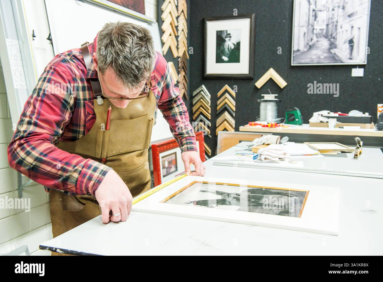 Framemaker inside his workshop Goirle, Netherlands. Mid adult male ...