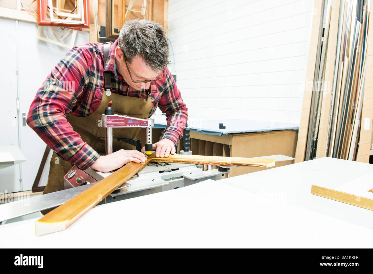 Framemaker inside his workshop Goirle, Netherlands. Mid adult male ...