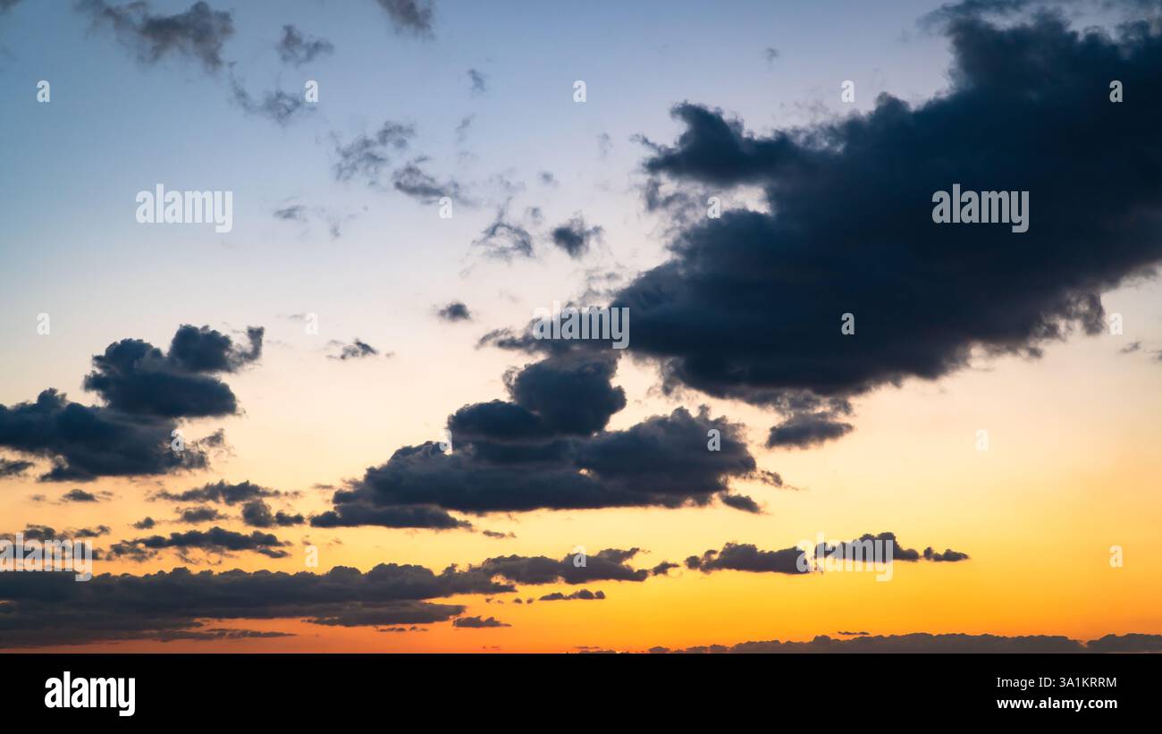 Sunset sky. Cirrocumulus and cirrostratus clouds during sunset. Beautiful dramatic sunset sky ...