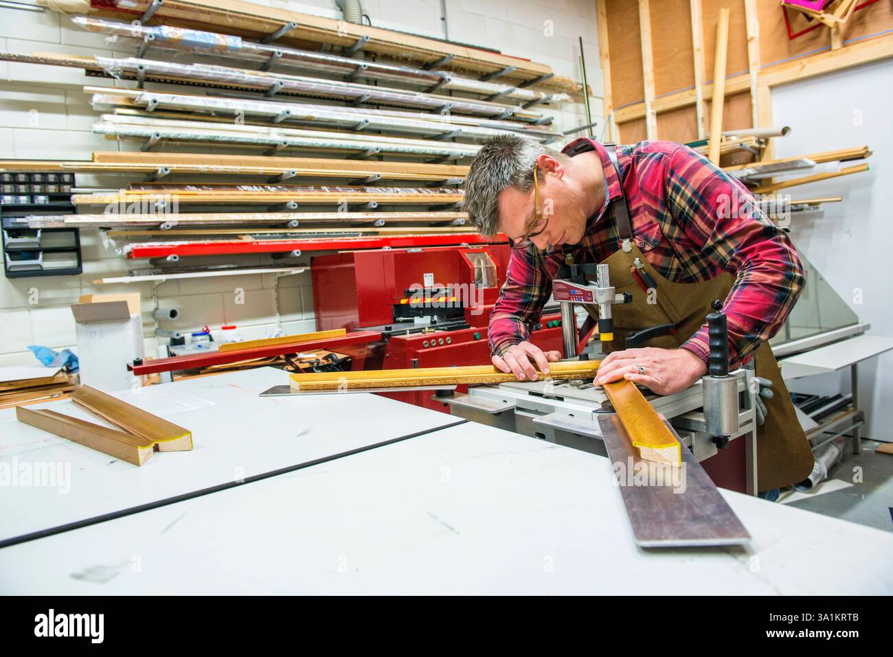 Framemaker inside his workshop Goirle, Netherlands. Mid adult male ...