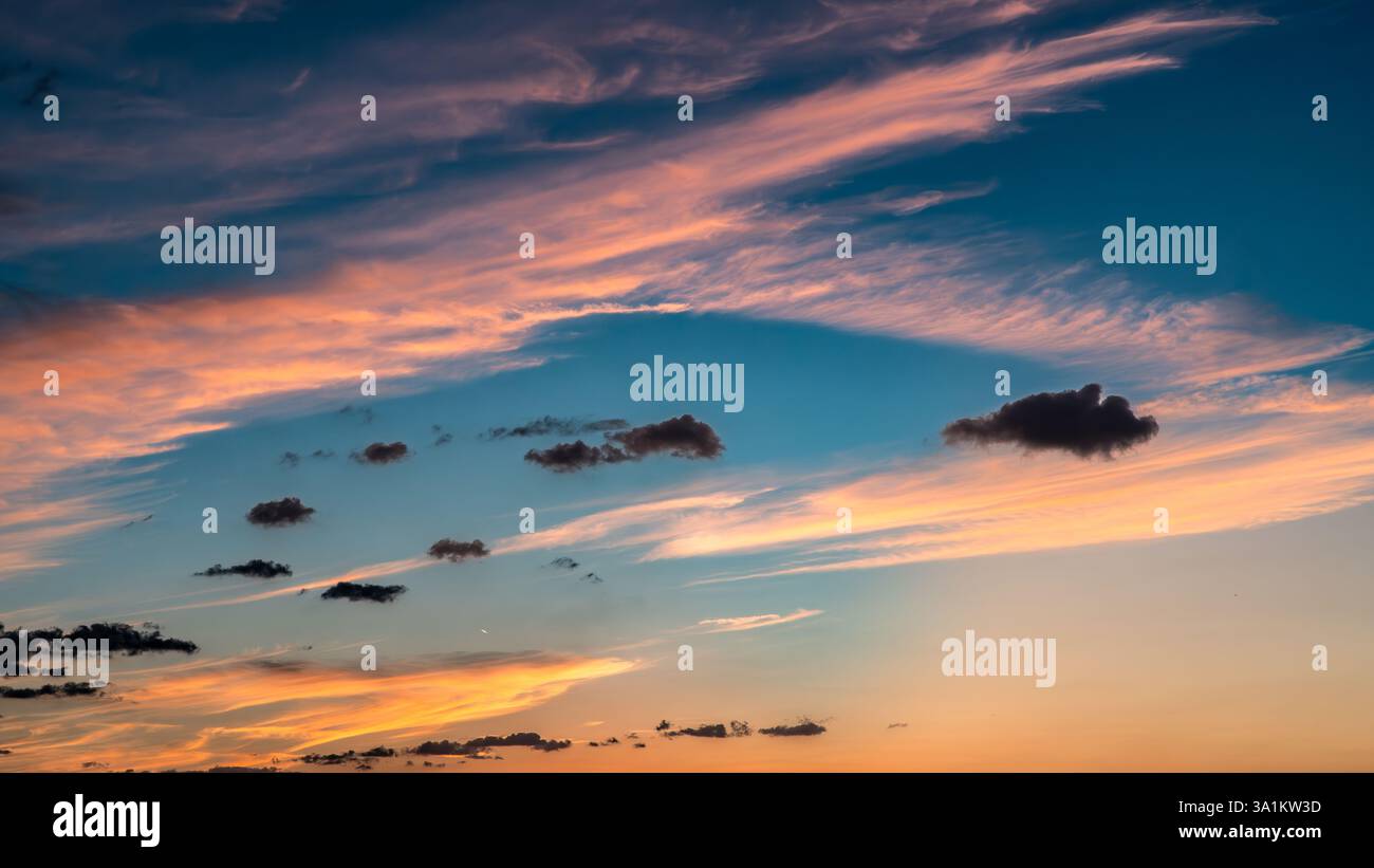 Sunset sky. Cirrocumulus and cirrostratus clouds during sunset. Beautiful dramatic sunset sky ...