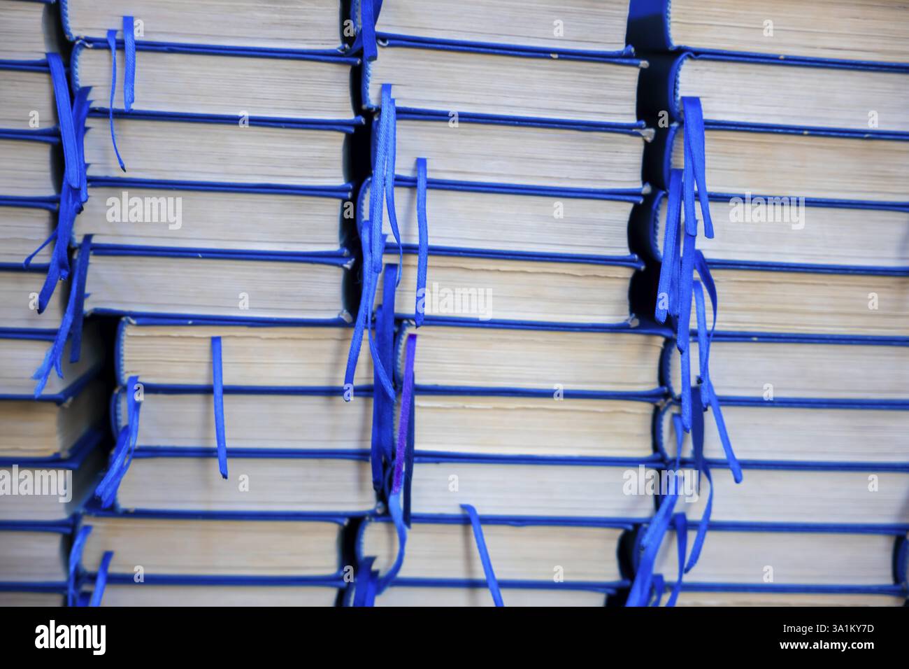 Many Blue Bible Stack in Switzerland Stock Photo - Alamy