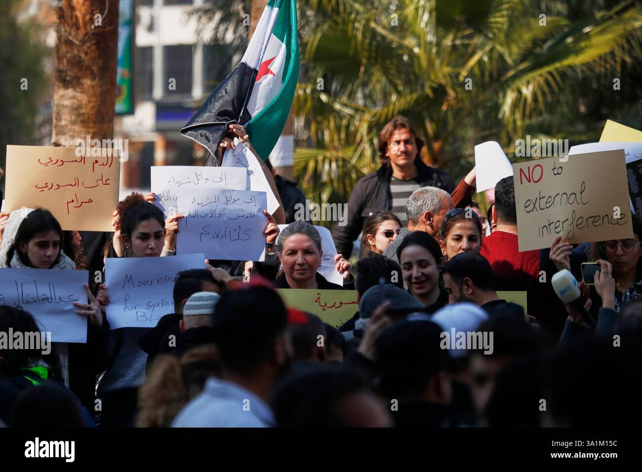 Activists protest against the recent wave of violence and sectarian ...