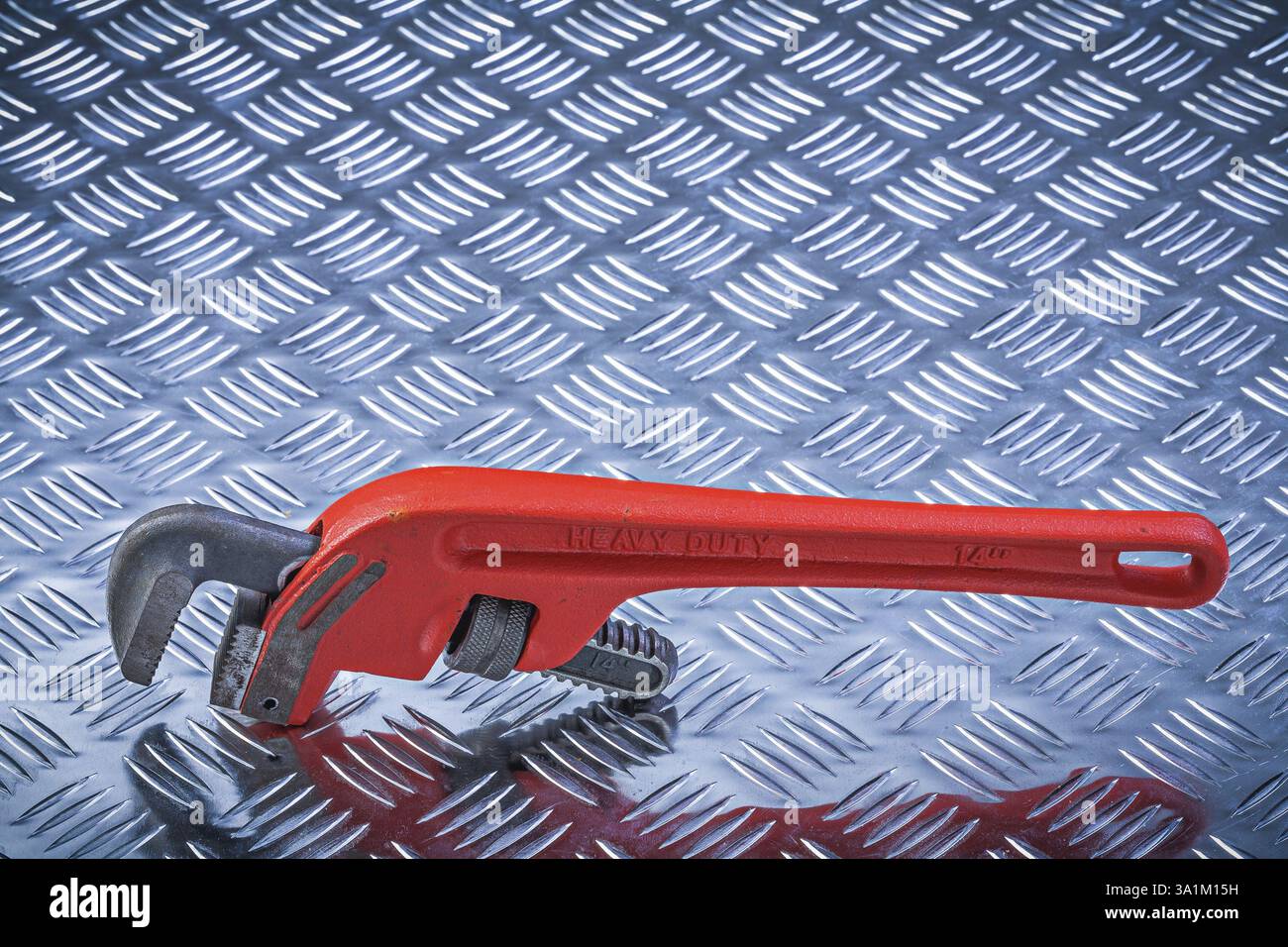 Metal pipe wrench on corrugated metallic plate maintenance concept ...