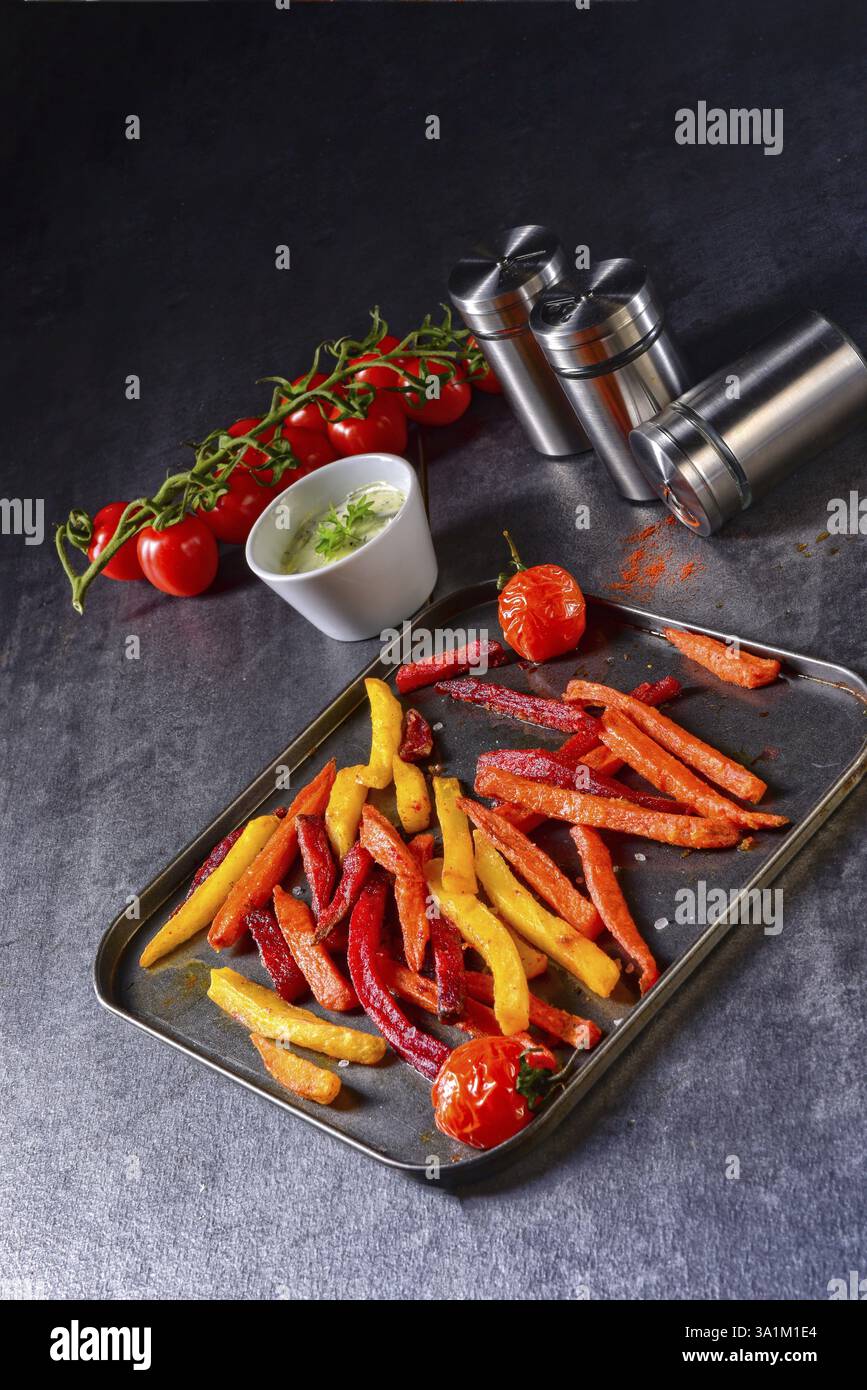 Colorful vegetable fries from the oven Stock Photo - Alamy