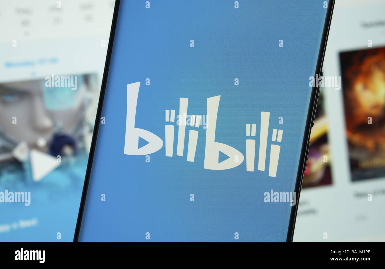 Bilibili logo is displayed on a smartphone screen, with the bilibili ...