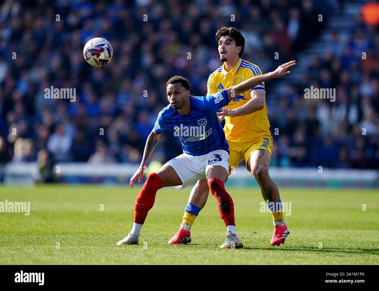 Portsmouth's Josh Murphy (left) and Leeds United's Pascal Struijk ...