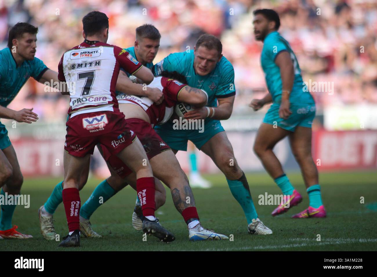Wigan, UK. 9th Mar 2025. Tom Burgess makes a tackle*** during the Super ...