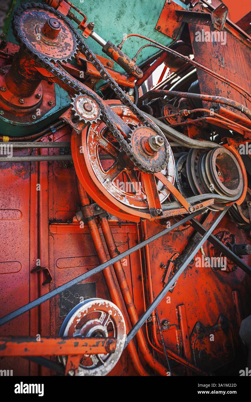 Red gear mechanism of old combine harvester Stock Photo - Alamy