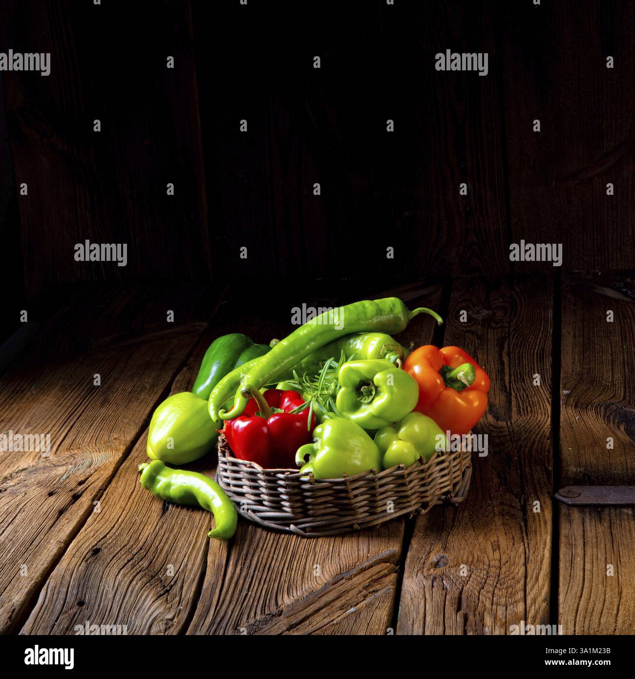 Various harvested peppers and hot peppers in basket Stock Photo - Alamy