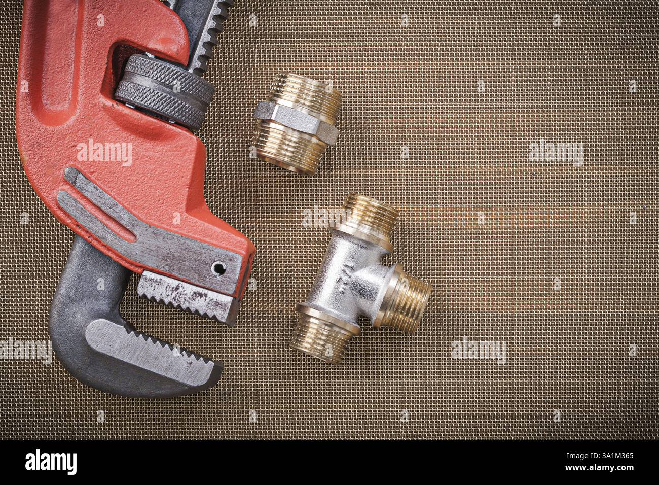 Pipe wrench brass plumbing fixtures on cleaning mesh filter grid Stock ...