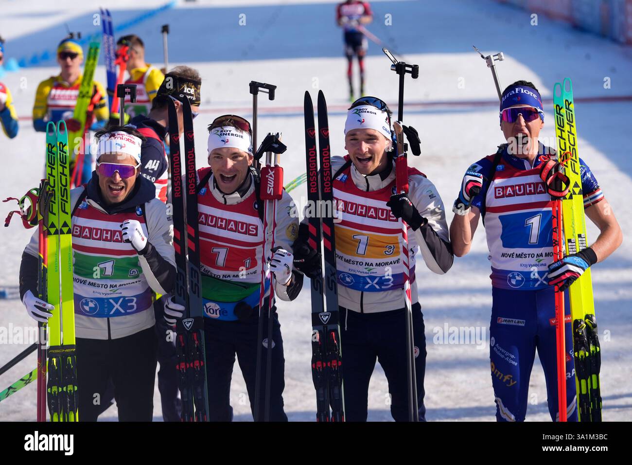 Team of France celebrates after winning the men's 4x7.5 km relay race ...