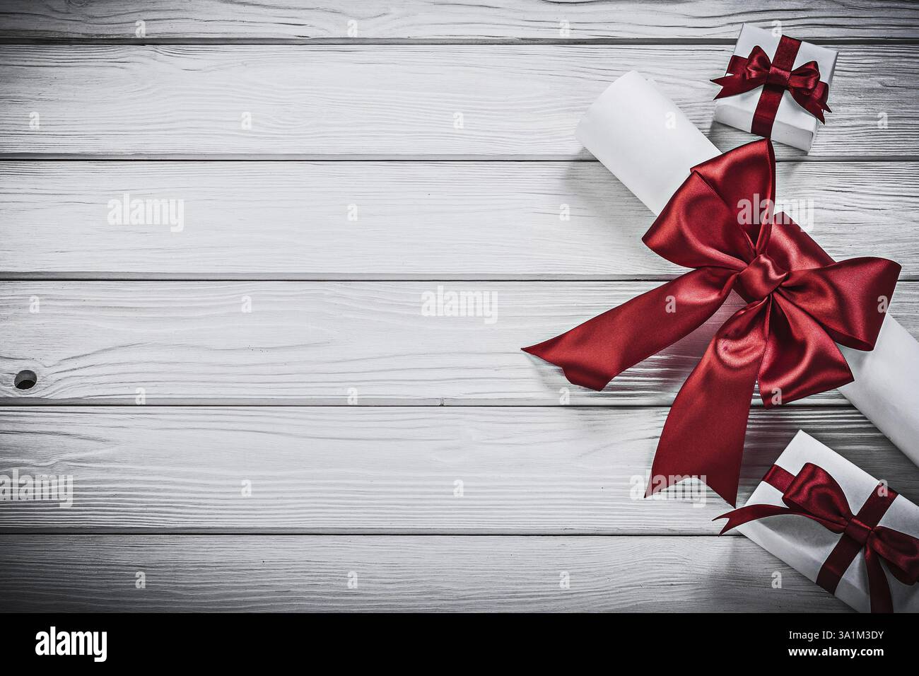 Paper roll with red ribbon present boxes holidays concept Stock Photo ...