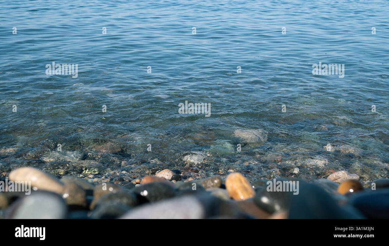 Rippling water waves washing shore hi-res stock photography and images ...