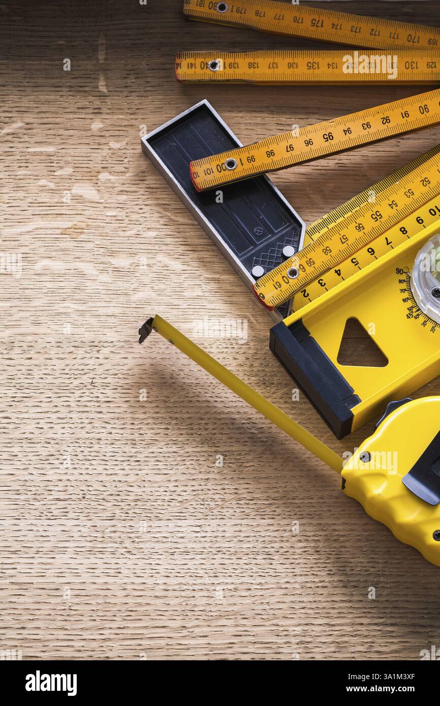 Oak board with wooden meter measuring tape construction level and ...
