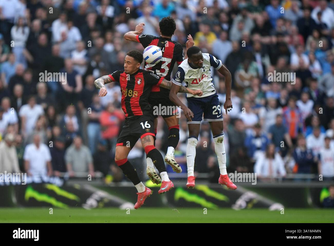 Tottenham Hotspur's Pape Matar Sarr (right) battles for the ball with ...
