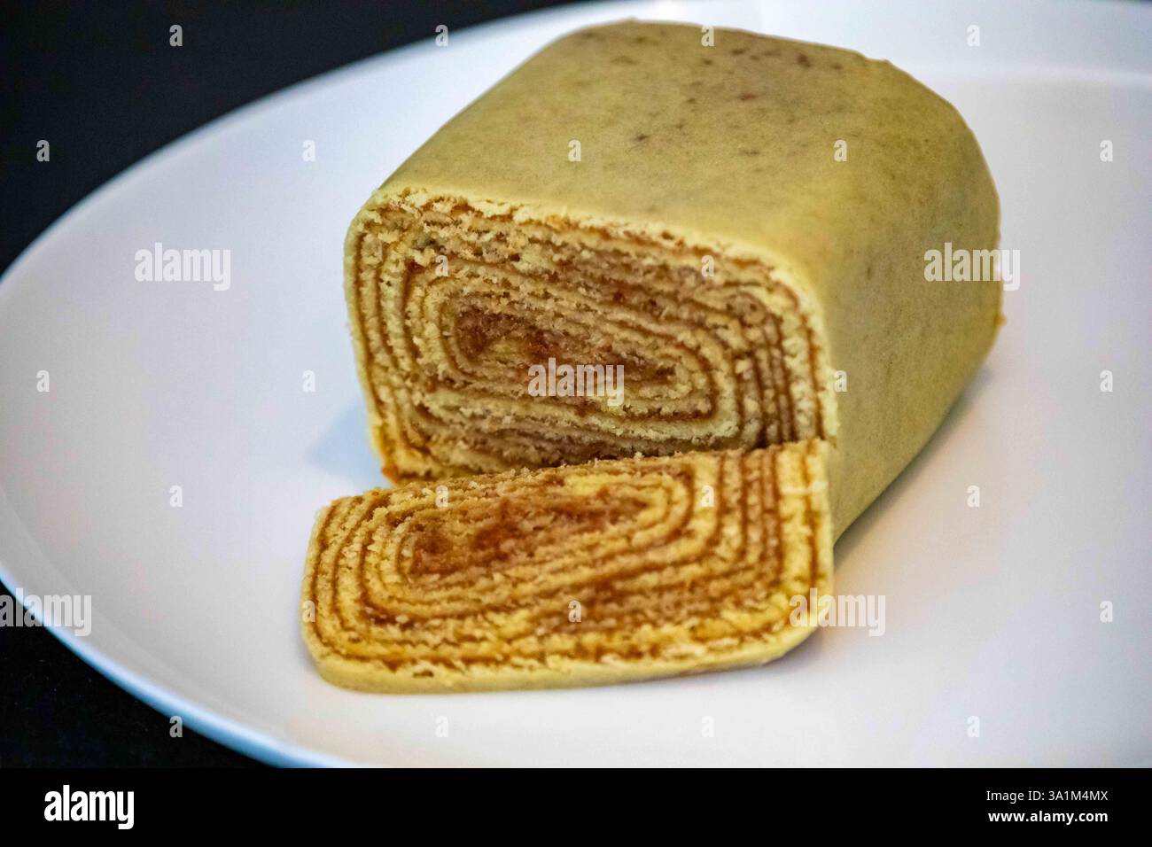 Traditional roll cake also known as Swiss roll, filled with guava paste ...