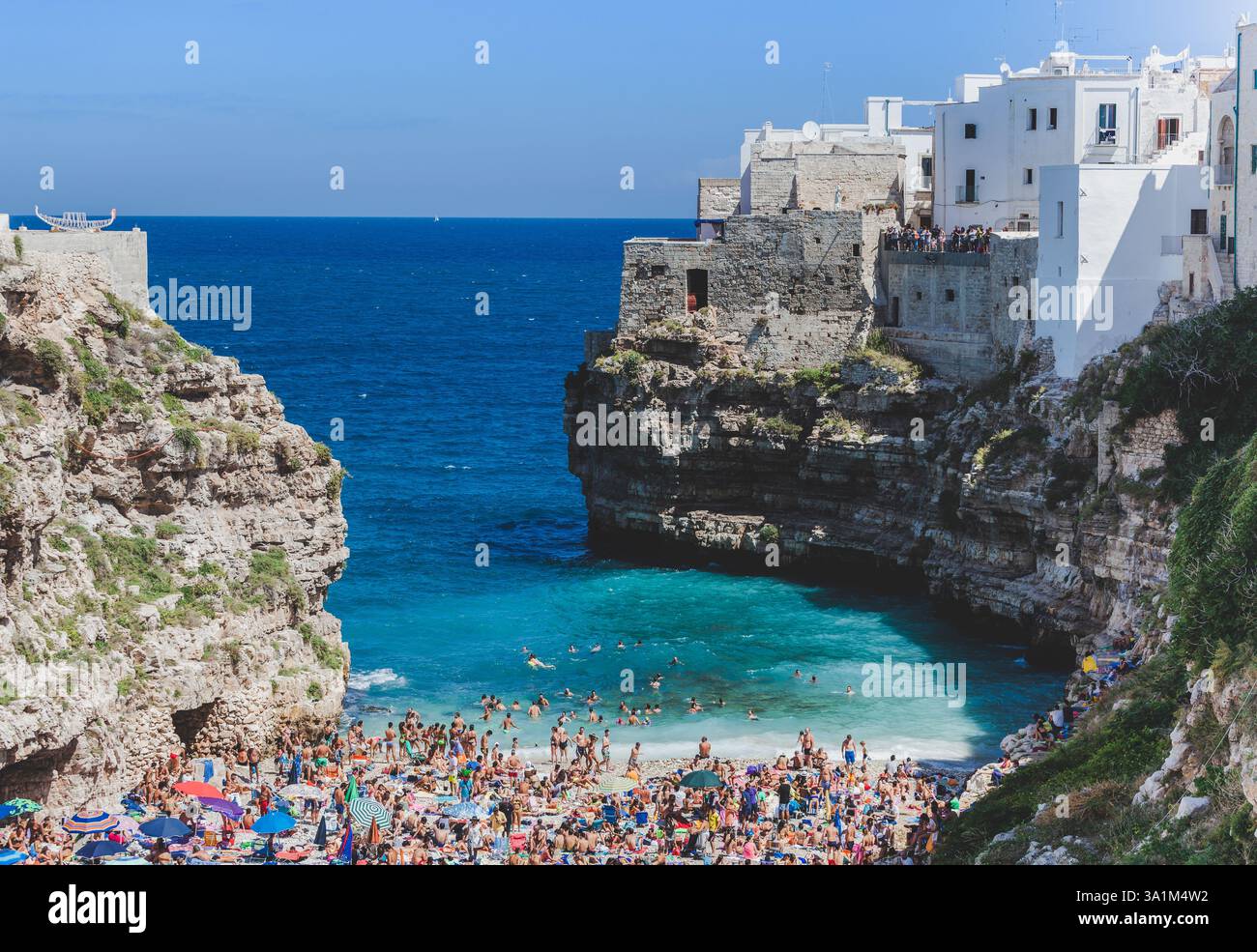 Tourists enjoying summer holidays sunbathing and swimming in the ...