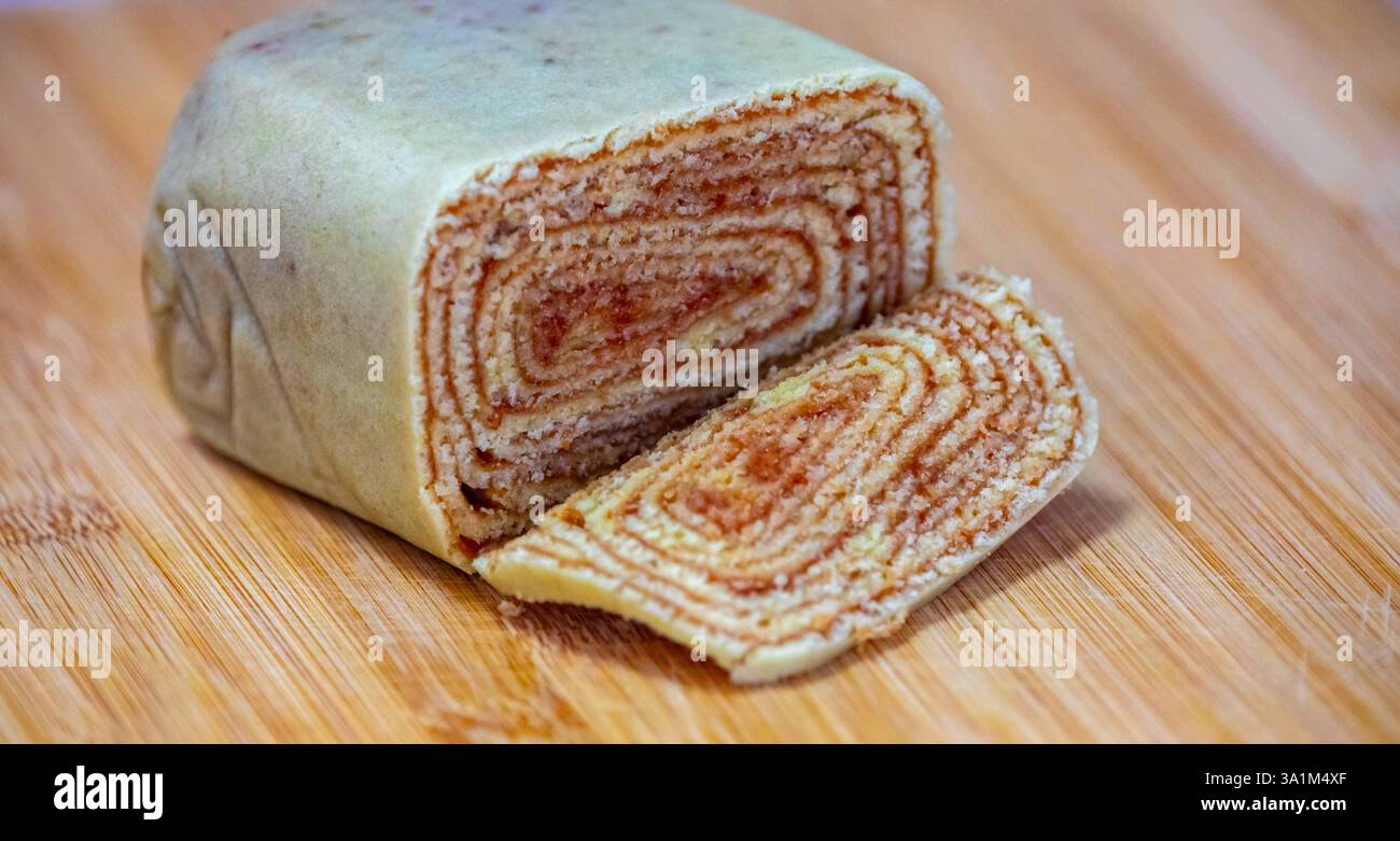 Traditional roll cake also known as Swiss roll, filled with guava paste ...