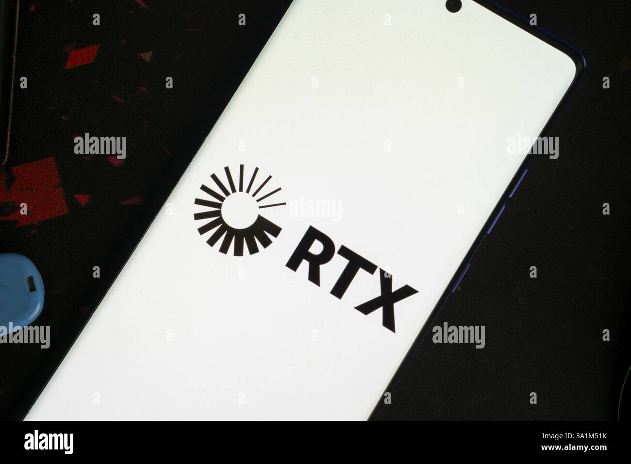 RTX Logo on Smartphoe, RTX manufactures aircraft engines, avionics ...