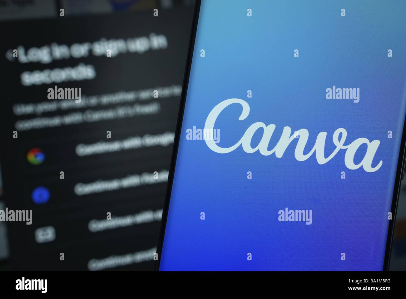 Canva logo is displayed on a smartphone screen, with the canva login ...