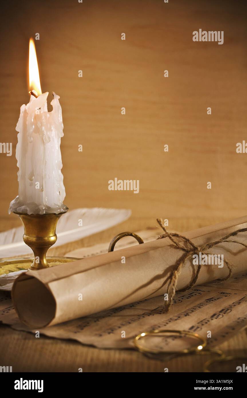 Roll of old paper andle candle Stock Photo - Alamy