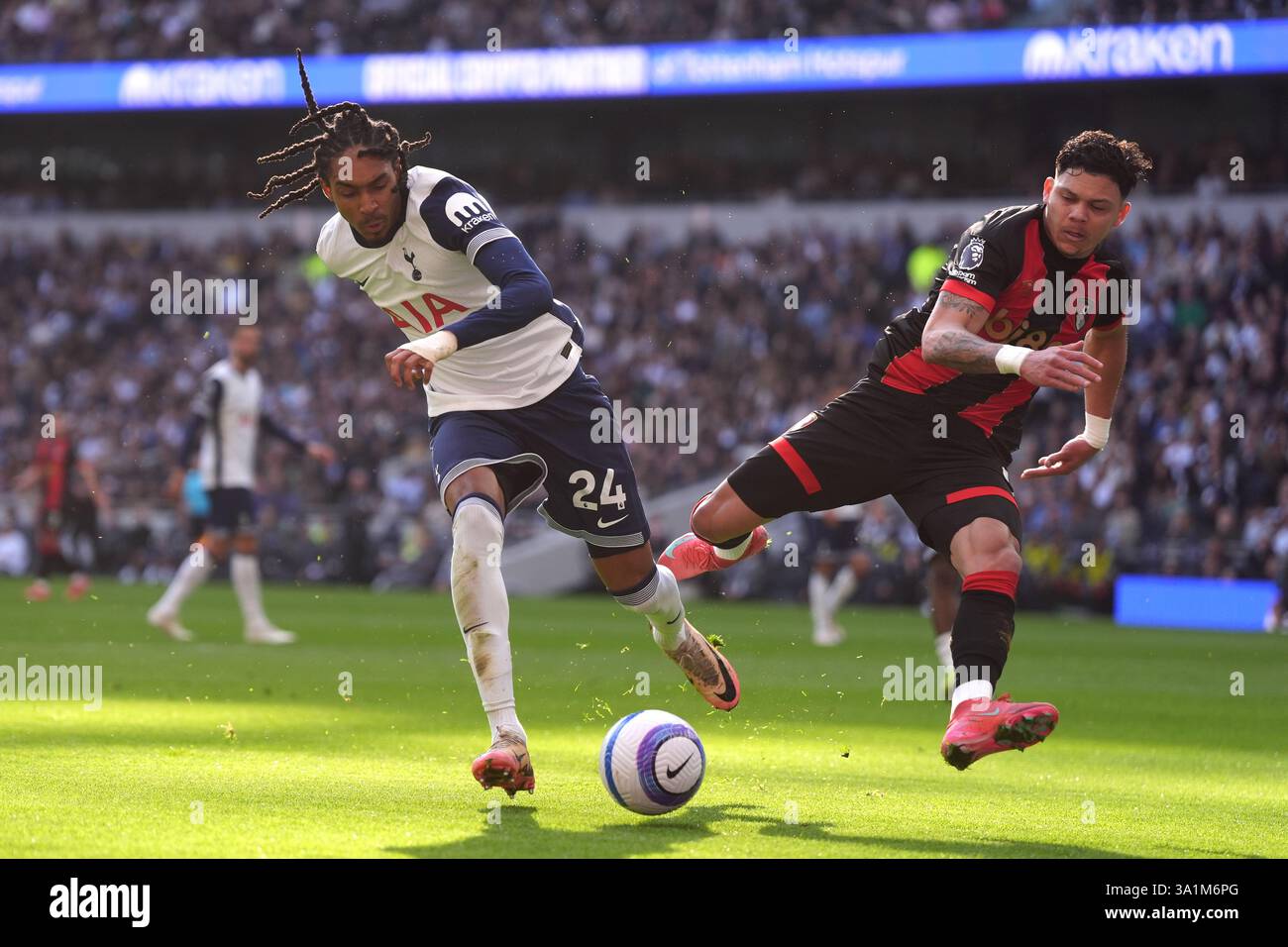 Tottenham Hotspur's Djed Spence (left) and Bournemouth's Evanilson ...