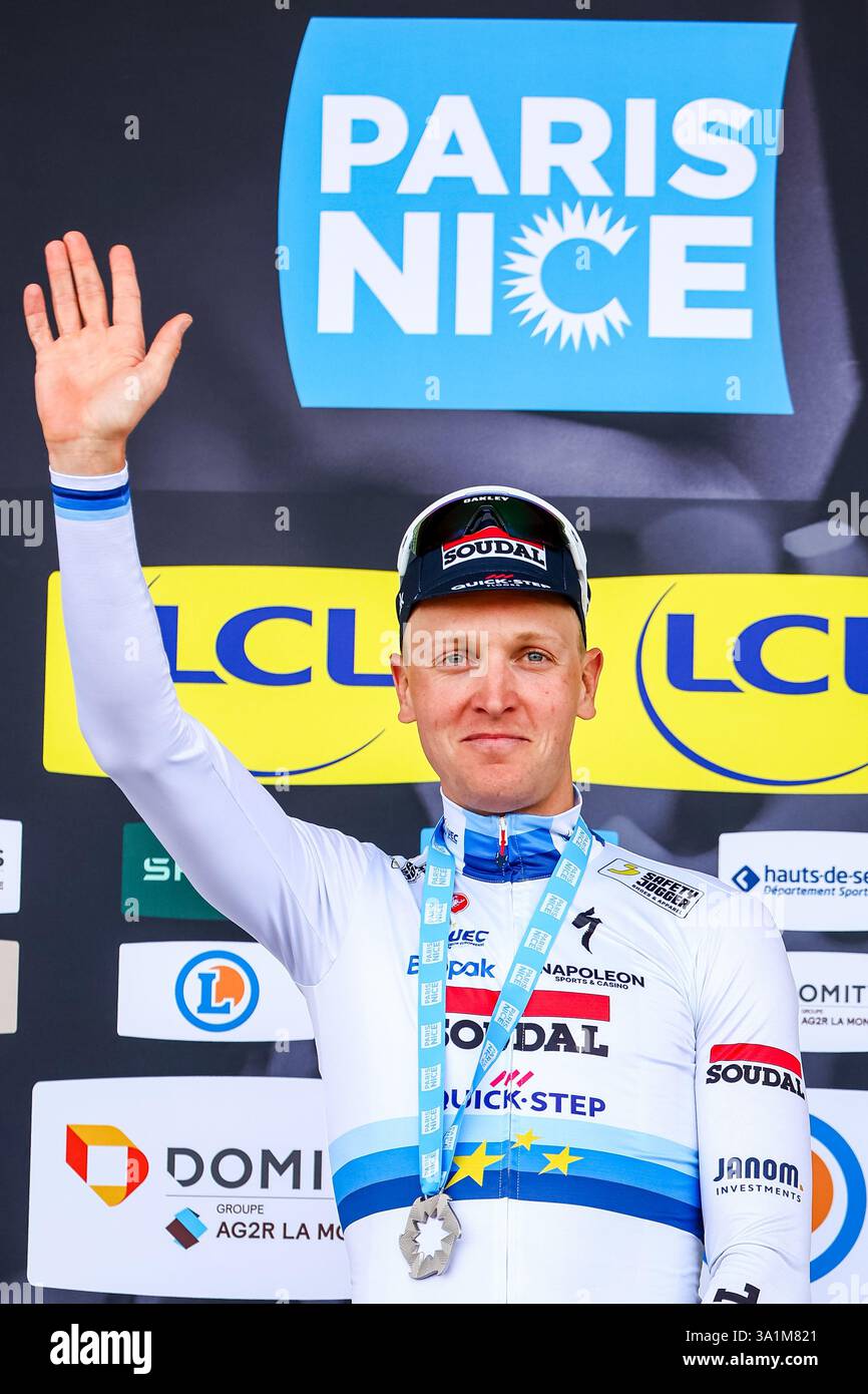 Belgian Tim Merlier of Soudal Quick-Step celebrates on the podium after ...