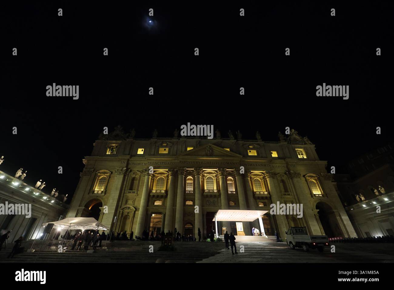 The moon appears above the sky of St. Peter's after the rosary ...