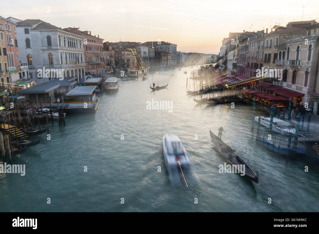 Evening light at sunset, view over the Grand Canal, gondola and boats ...