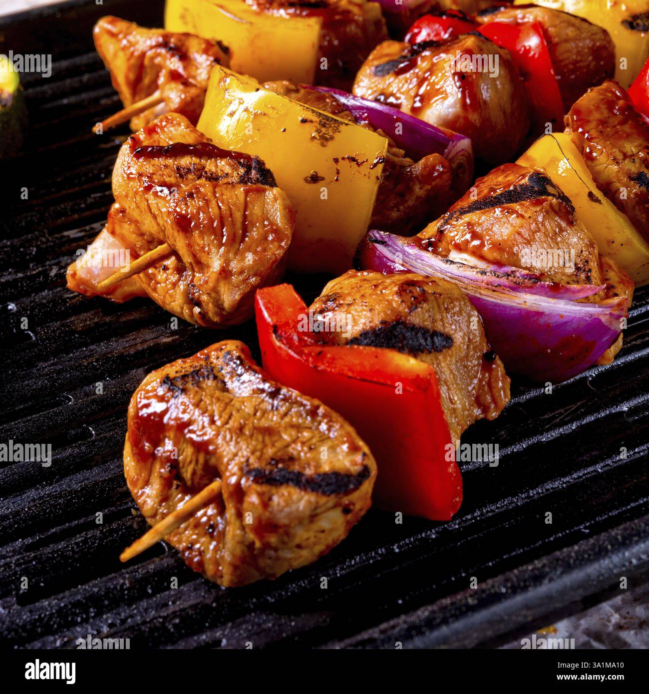 Rustic shish kebab skewers with marinated ham meat paprika and red ...