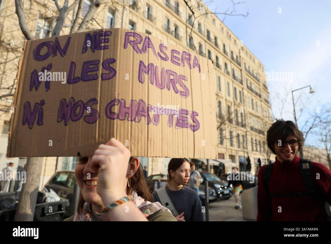 The signs held by the protesters display messages of support for the ...