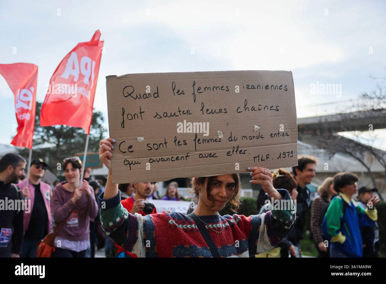 The signs held by the protesters display messages of support for the ...