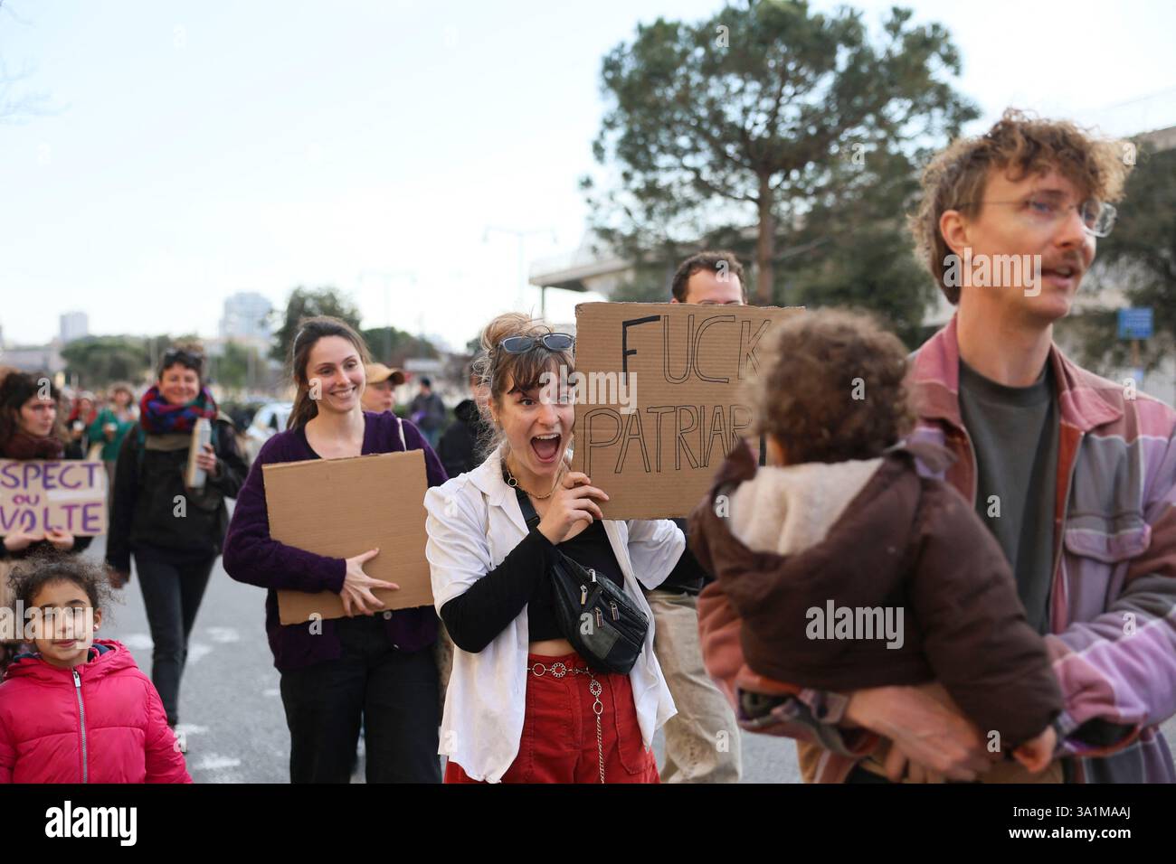 The signs held by the protesters display messages of support for the ...