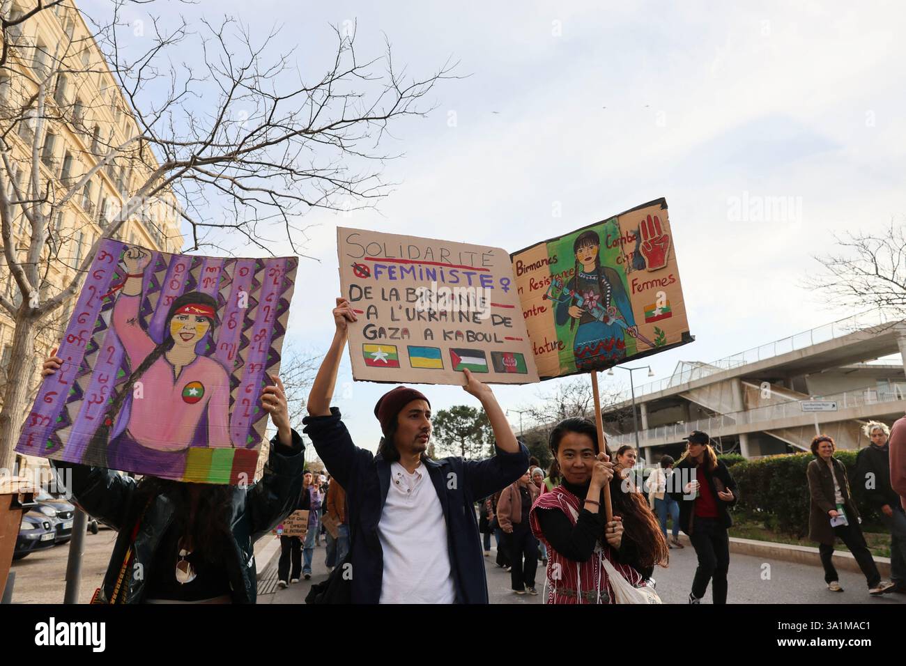 The signs held by the protesters display messages of support for the ...
