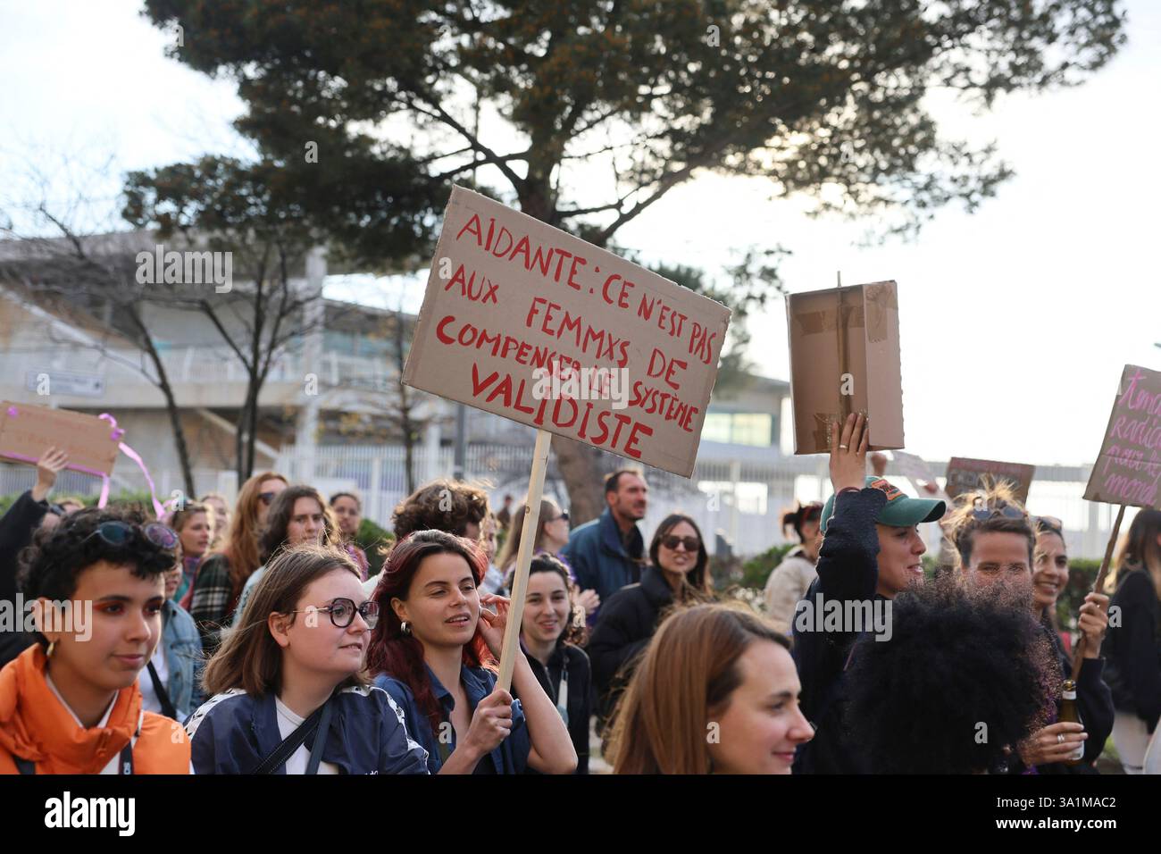 The signs held by the protesters display messages of support for the ...