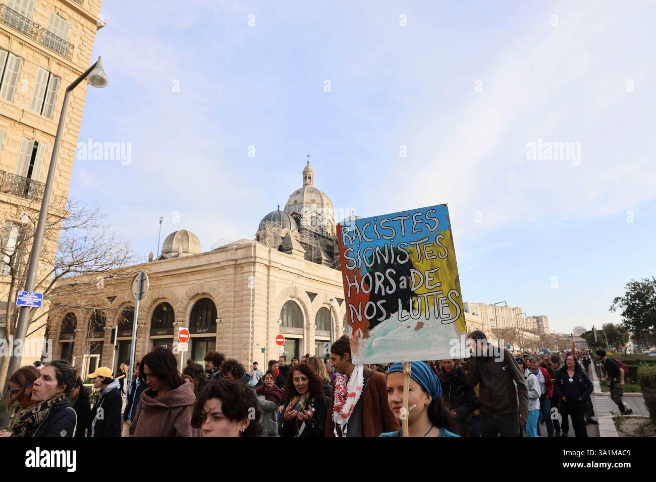 The signs held by the protesters display messages of support for the ...